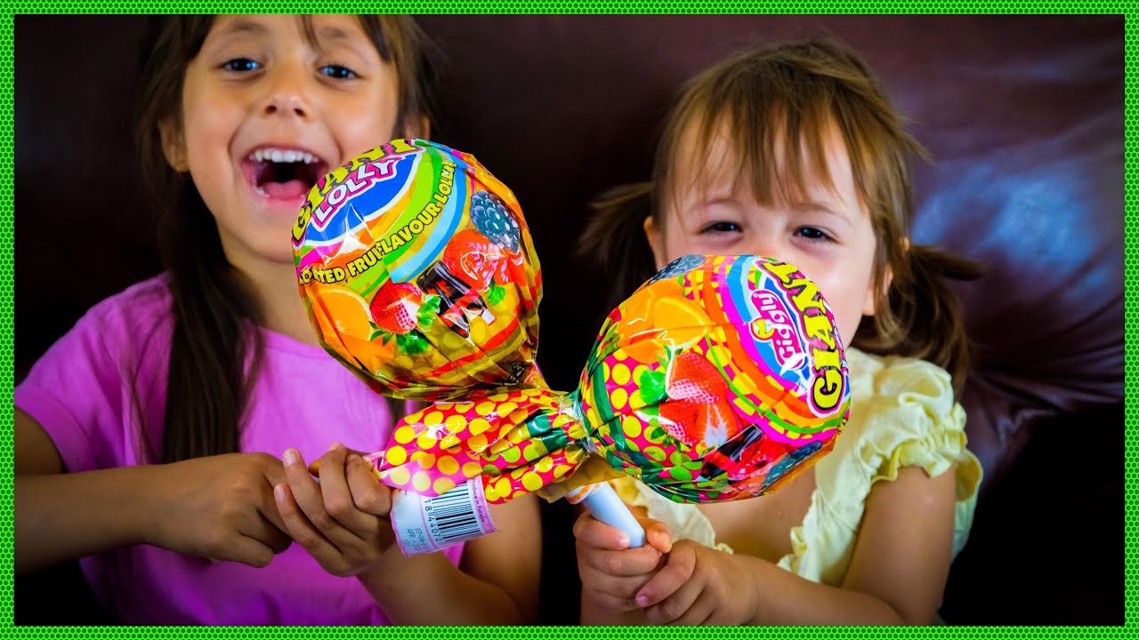 Kids counting numbers with giant colourful lollipops - YouTube