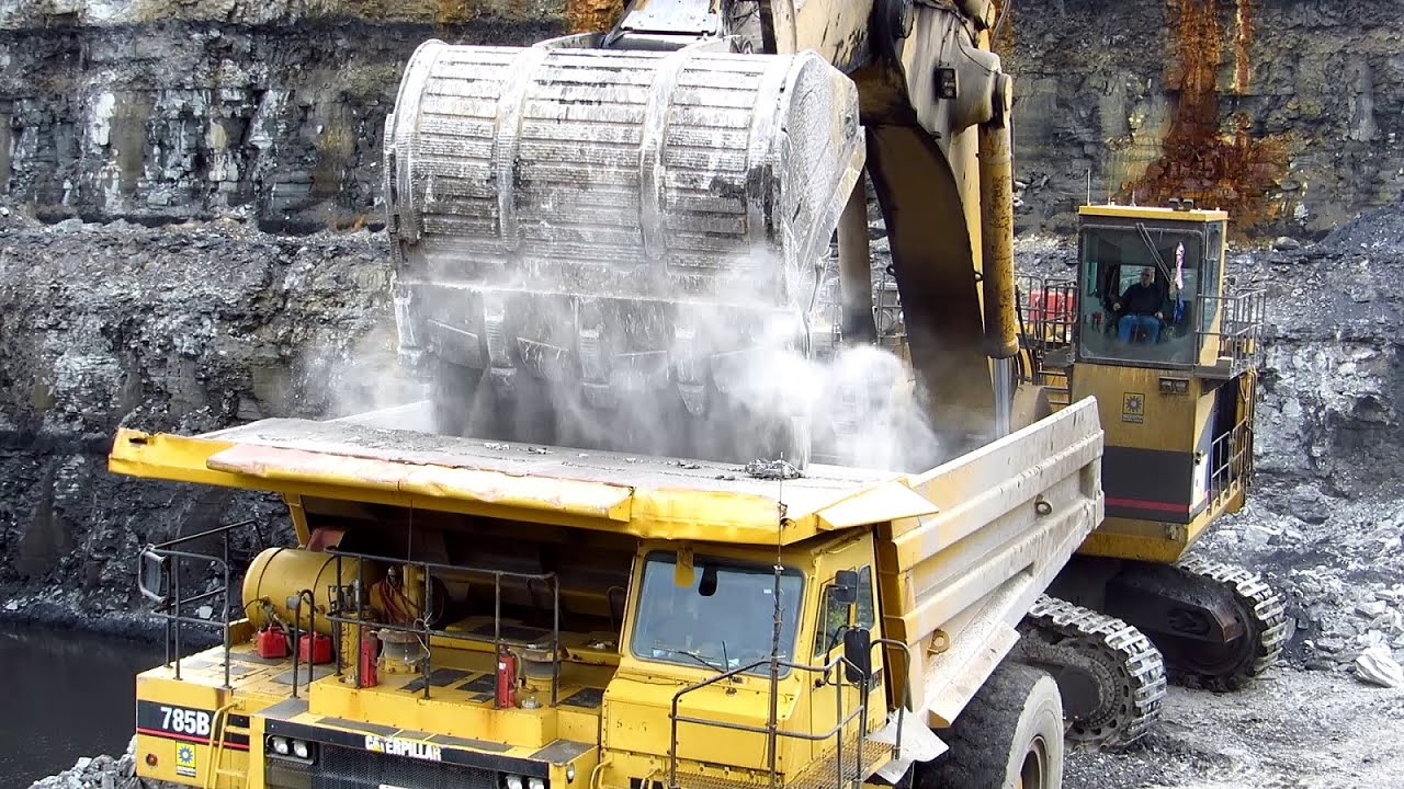 Caterpillar 5230 Loading Blasted Rock - YouTube