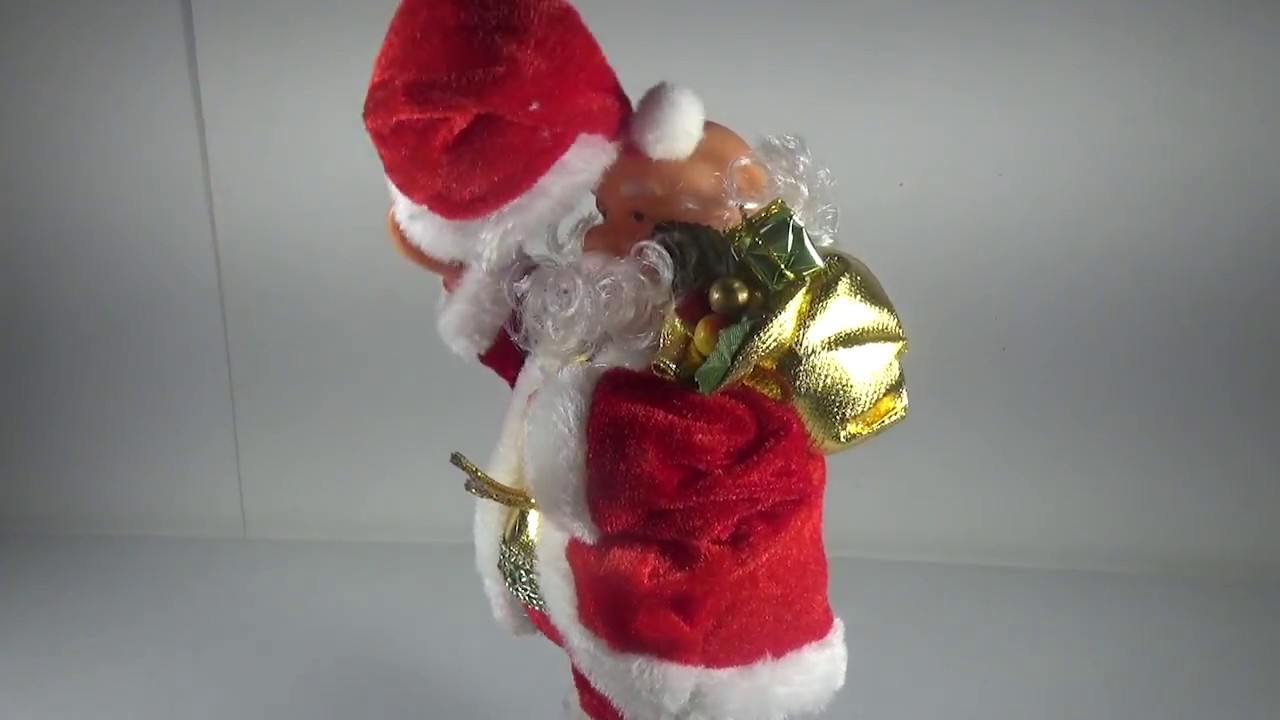 Bald Santa Claus Toy Figure Twirling And Playing With Santa Claus Hat ...