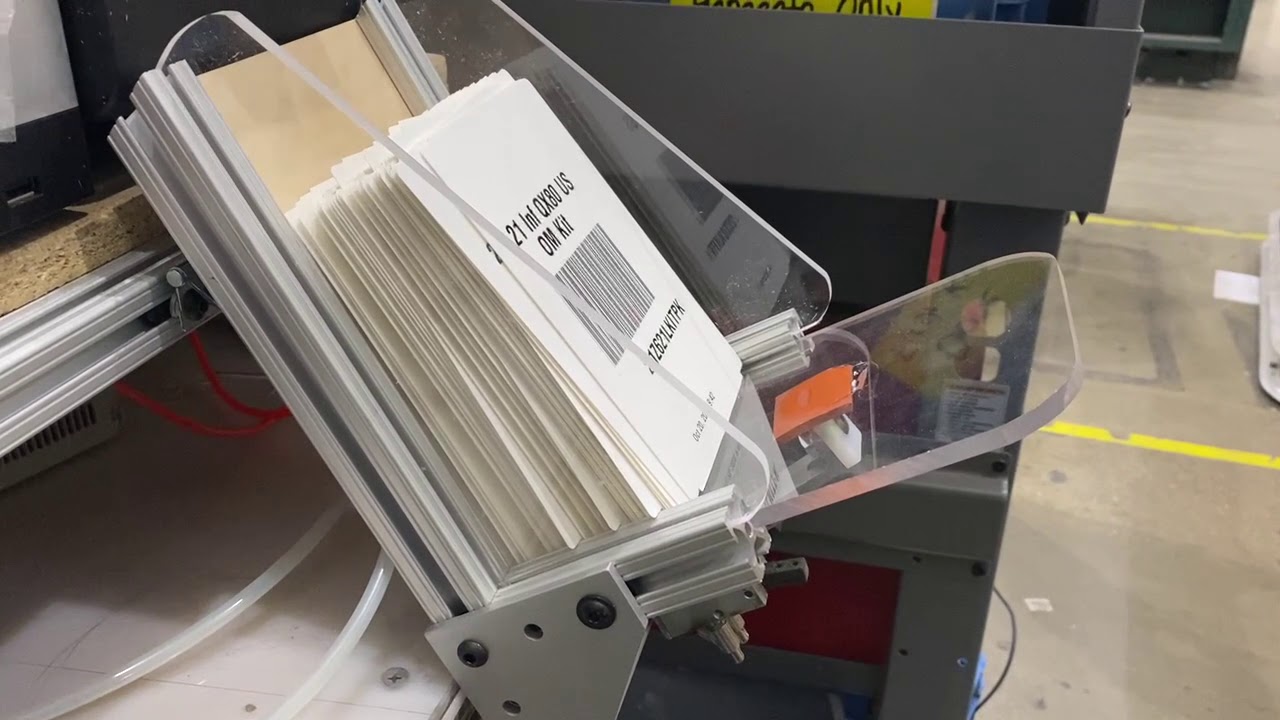 Shaking label hopper to settle cards - YouTube