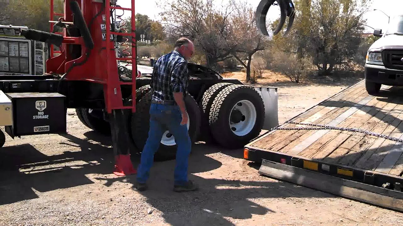 Unloading flatbed trailer - YouTube