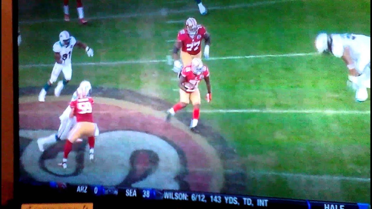 Frank gore gets hit by his own player - YouTube