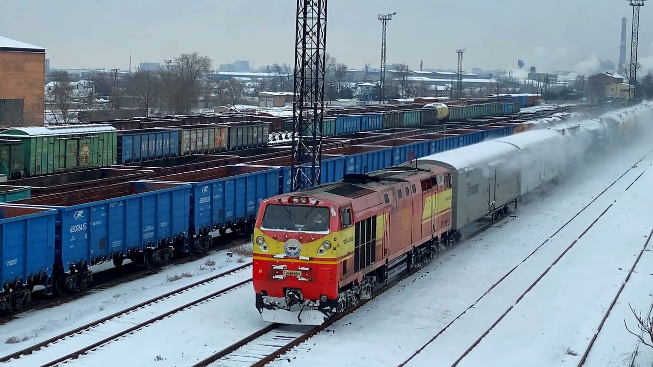 Diesel locomotive TE33A 0269 with a freight train departs from the ...
