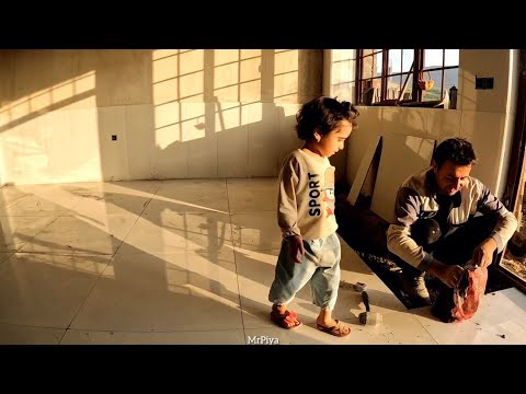 Finishing the building floor, Ariana helps her father