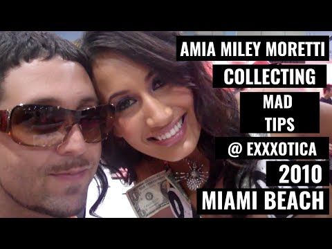 XXX Star Amia Miley Moretti @ Exxxotica 2010 Miami Beach Getting Tips | TheMisterJoshPodcast.com