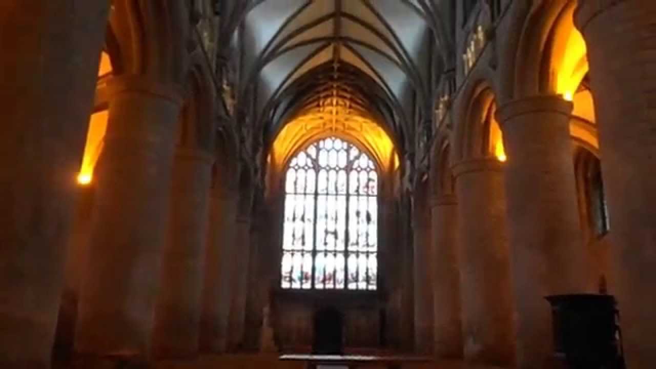 Interior of Gloucester Cathedral & choral singing in evening service ...