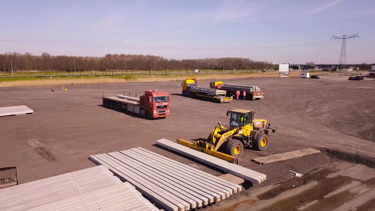 8.000 Heipalen voor nieuwbouw Flamco Almere - YouTube