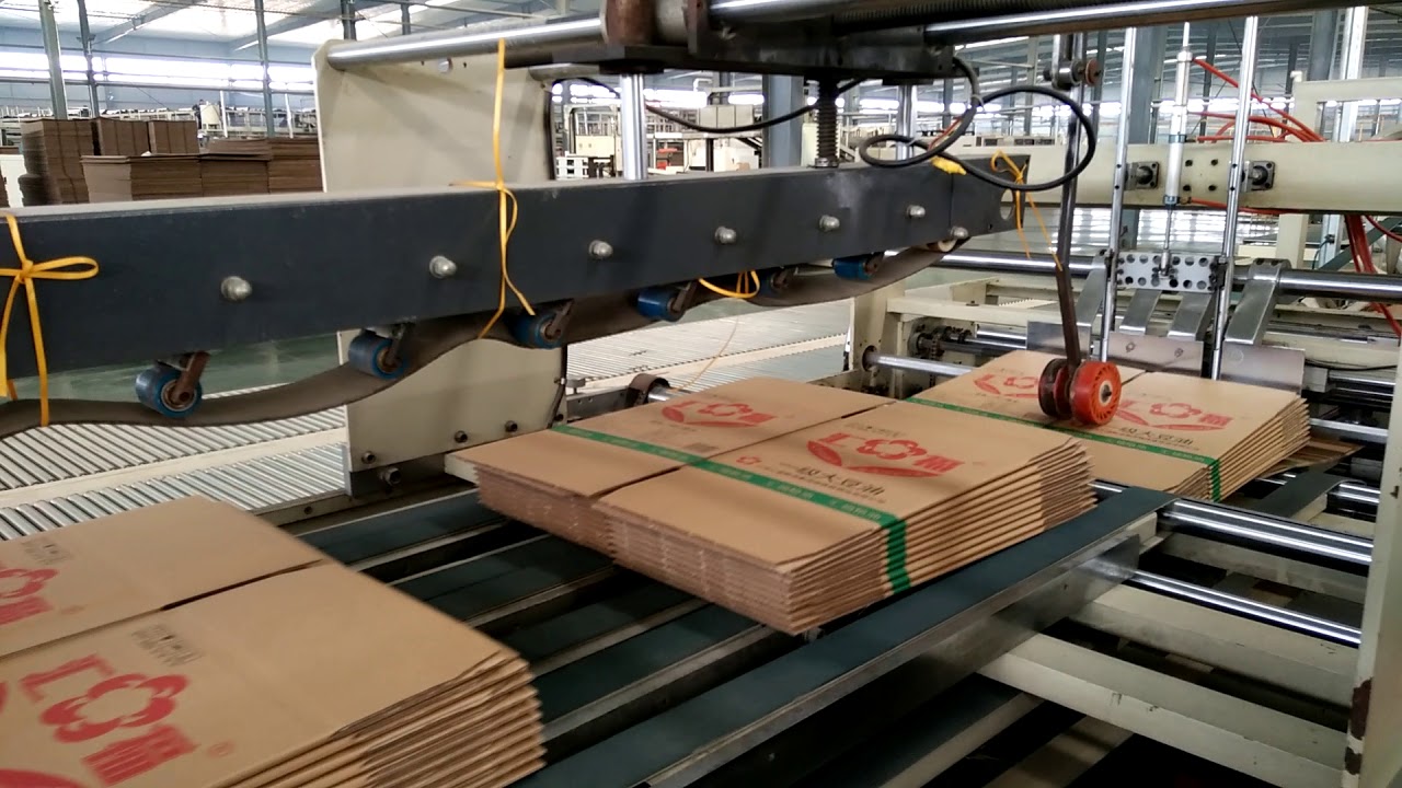 Corrugated carton folding and gluing machine, folder gluer - YouTube