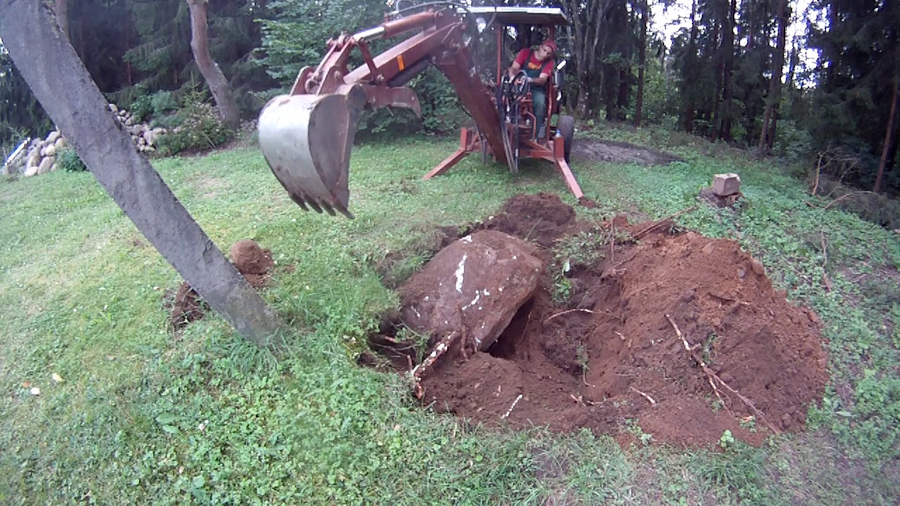 digging out a big stone with homemade excavator - YouTube