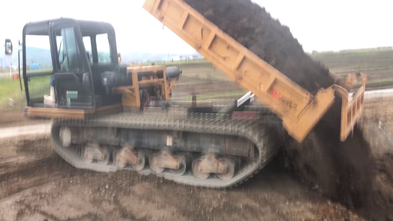 BACKHOE OPERATING ON A RICE FIELD! - YouTube