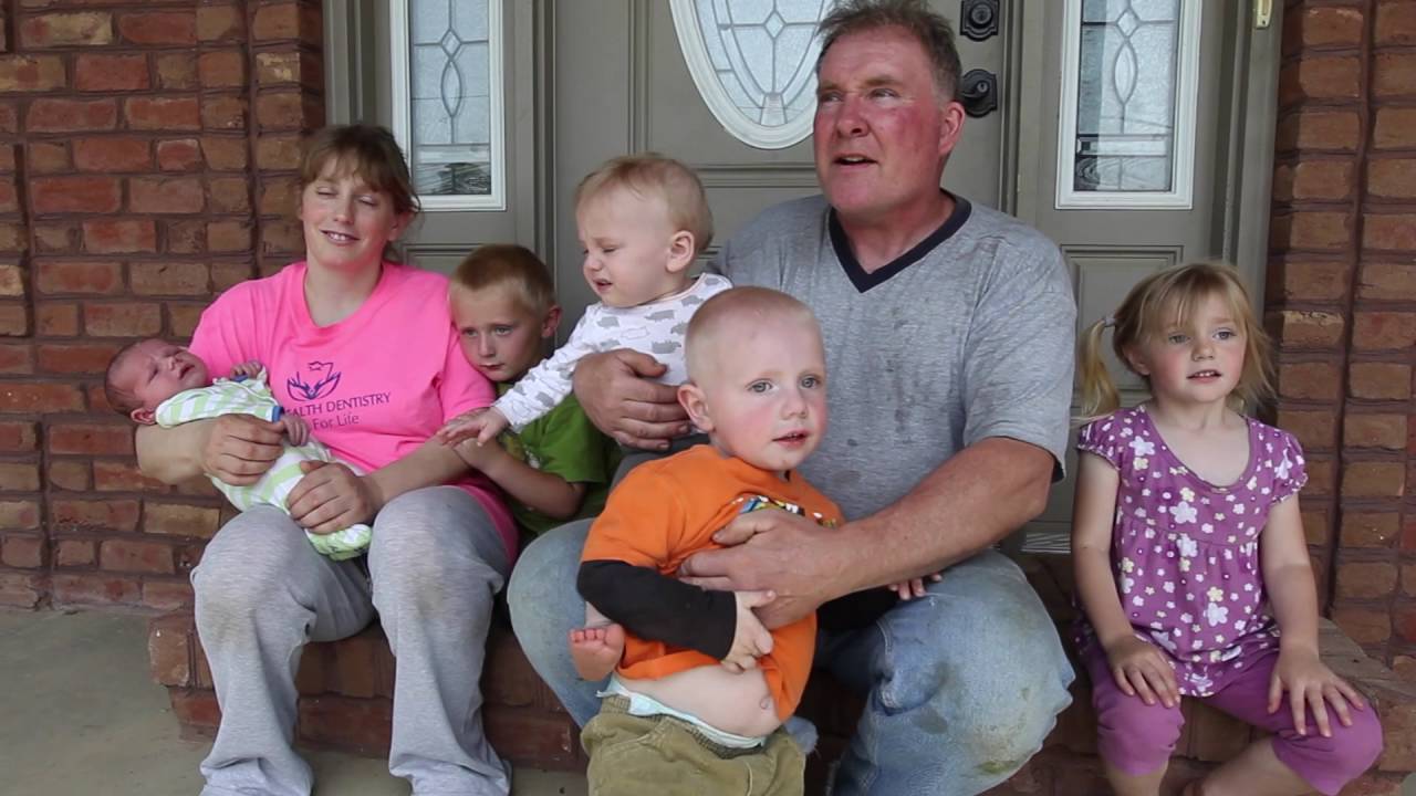 The Clouse family poses for a photo with the new baby - YouTube