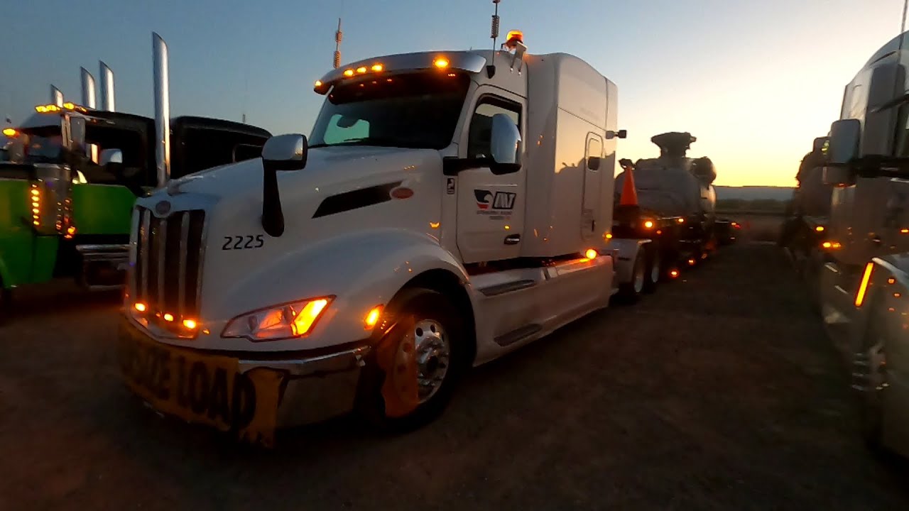 White Peterbilt Truck Hauling A Back Hawk Helicopter In Washington ...