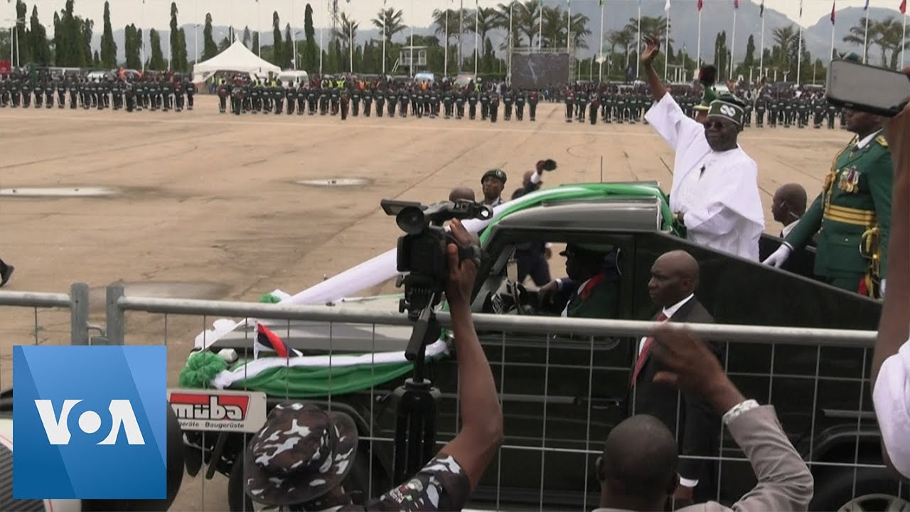 New Nigerian President Bola Tinubu Waves to Crowds | VOA News - YouTube