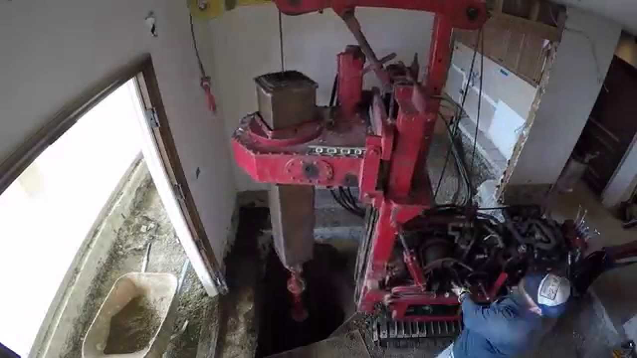 Limited access drilling rig stemming to get deeper inside house - YouTube