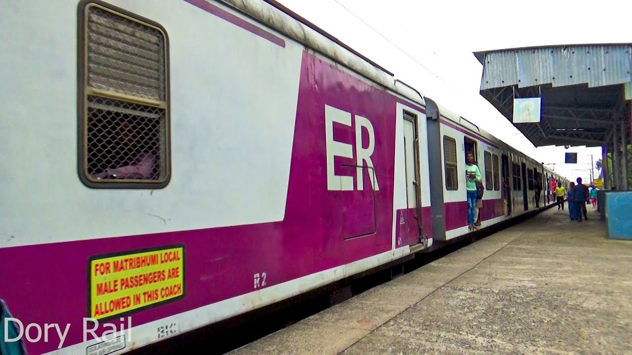 ICF MEDHA local train at station lot of passenger activities around ...