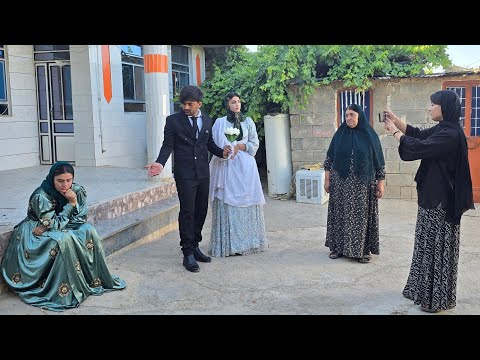 The third wife's request to Pourya, who wants a wedding photo to prove it to her father.