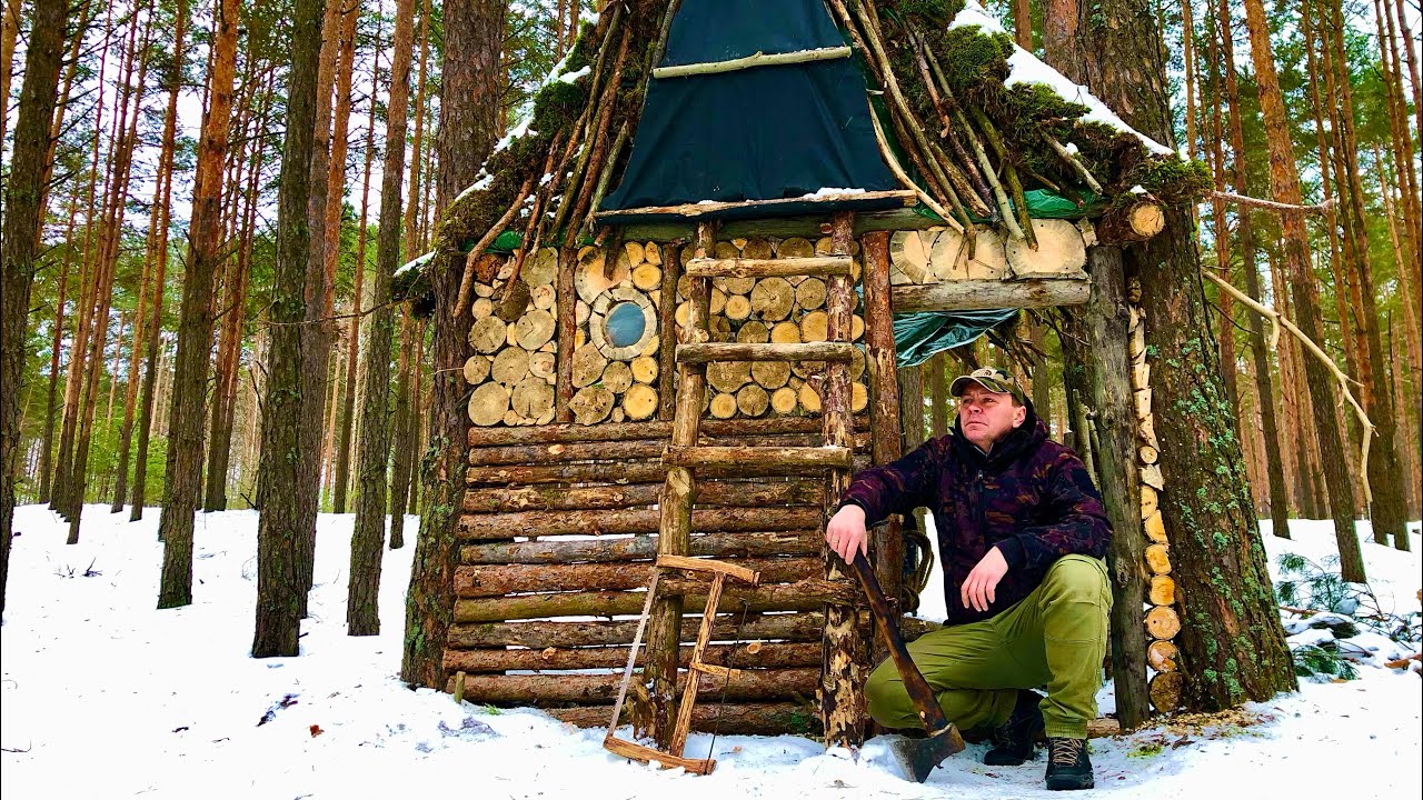 Winter Bushcraft. Surviving in a log cabin. Building a tree house in ...