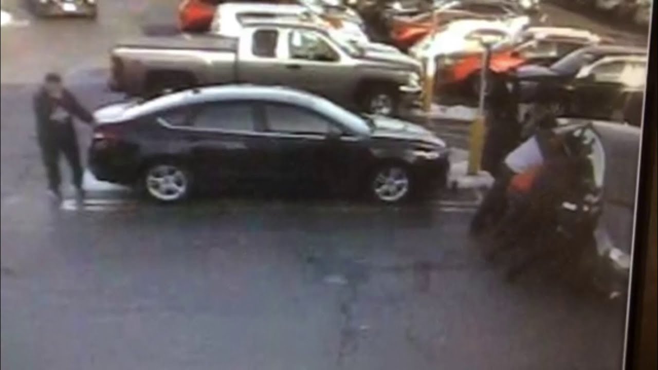 Surveillance video shows group lifting car off woman in Quincy - YouTube