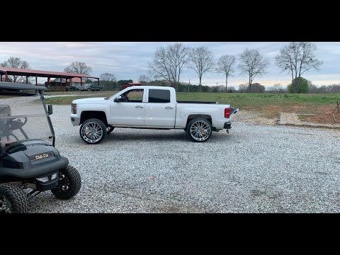 Squatting a 2014 chevy silverado - YouTube