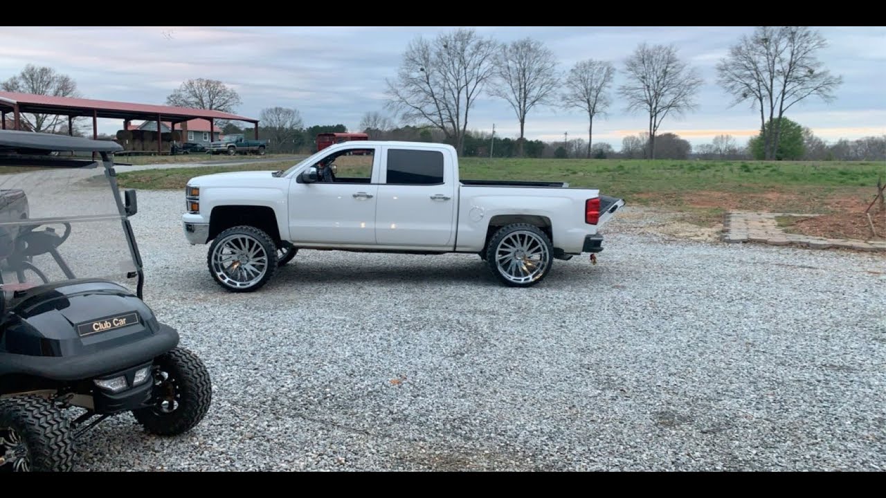 Squatting a 2014 chevy silverado - YouTube