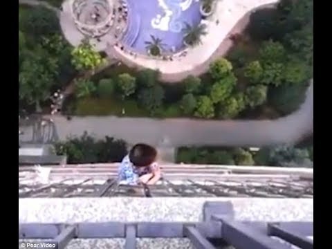 Five-year-old boy rescued after nearly falling off 19th-floor balcony ...