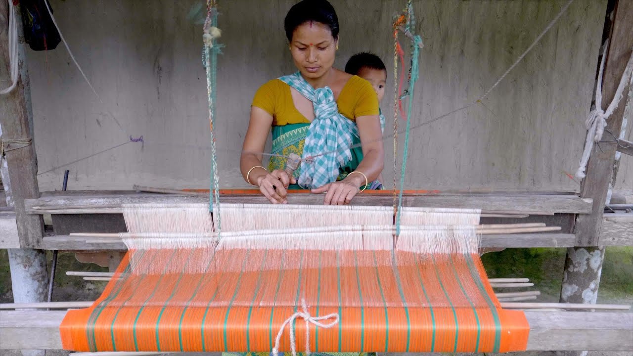 Woman uses Assamese traditional loom, weaves on Majuli island in the ...