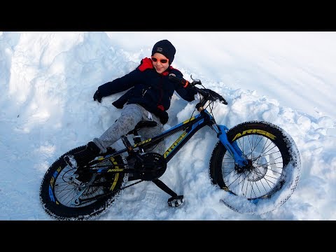 Kid Biker Ride on Power Wheels & Pretend Play with Magic Toys in the Snow / Outdoor Fun Activities