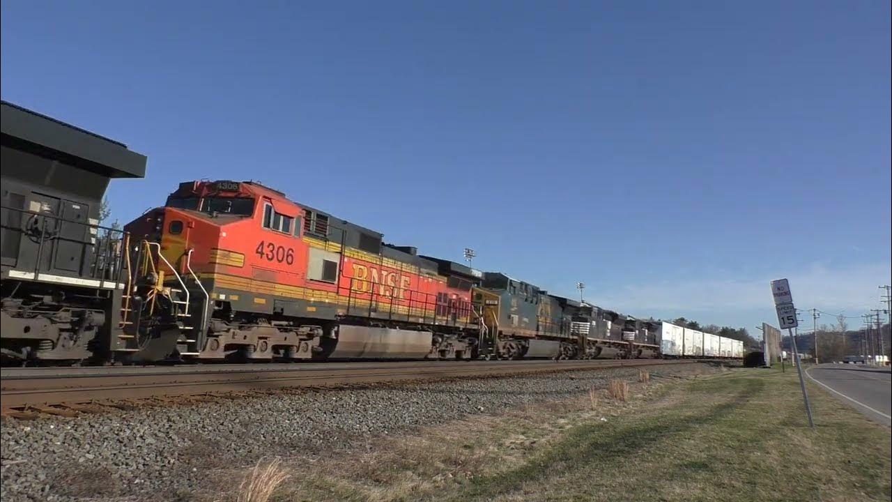 NS 13V with a BNSF dash 9, vandalized CSX unit and 2 SD70M-2s - YouTube