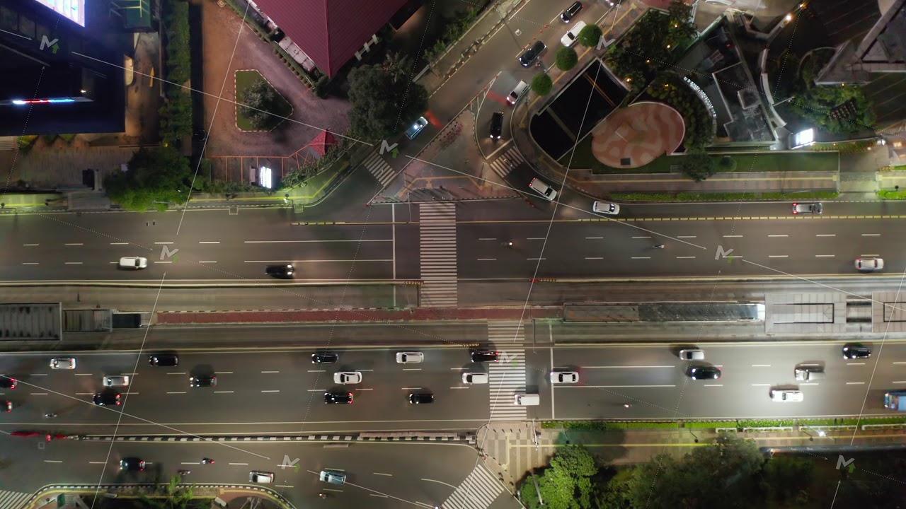 Top down overhead birds eye aerial view of cars and motorcycles driving ...