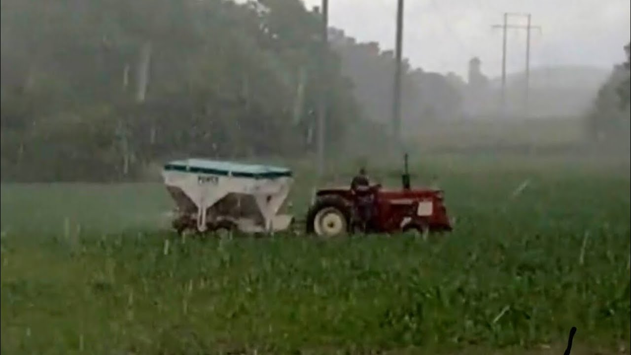 FARMER GETS SOAKED TOP DRESSING CORN IN THE RAIN - YouTube