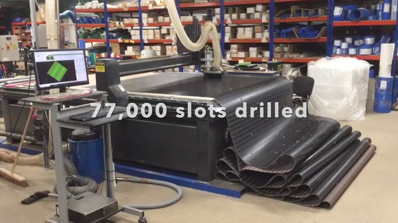 GB Belting automated CNC machine drilling 77,000 holes in a belt. - YouTube