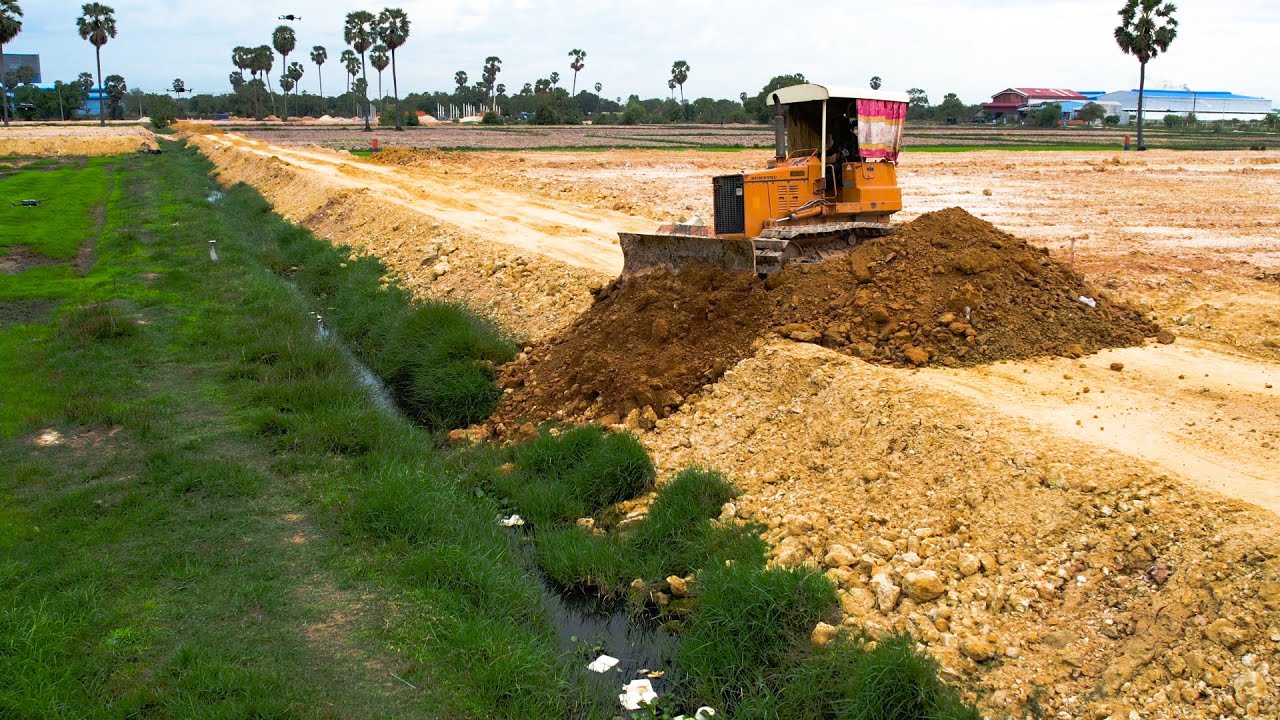 Skill Dozer and Dump Truck at Land Side Filling Processing with great ...