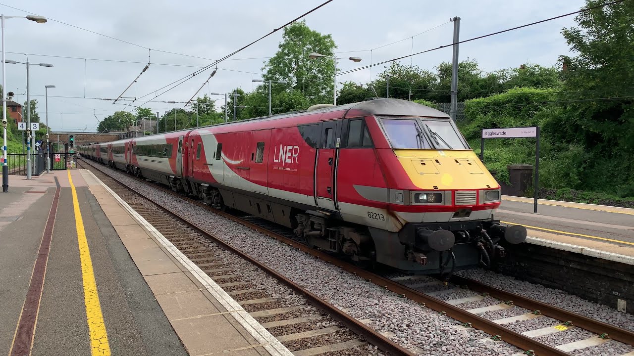 Recently reinstated LNER class 91, 91105 speeds past Biggleswade ...