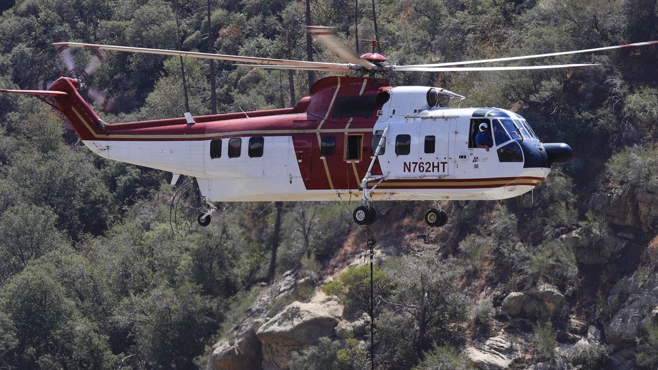 Sikorsky S-61 L .... Helicopter Transport Services sets poles for ...