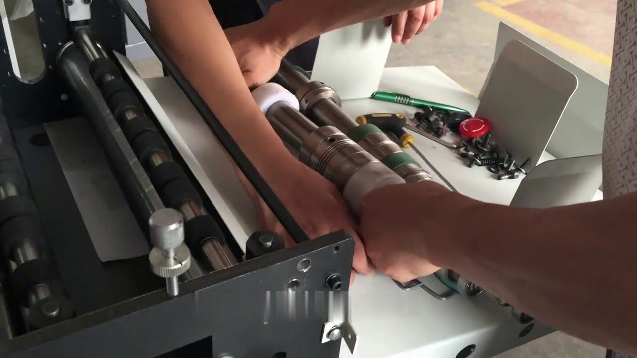 Video of change the wheels on automatic creasing machine - YouTube