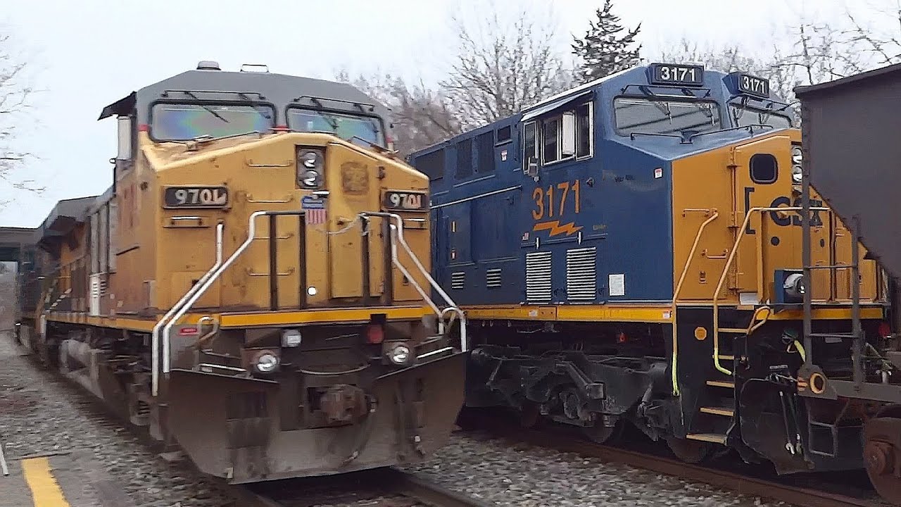 Brand New CSX Passing Union Pacific in St Denis - YouTube