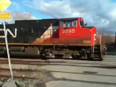 CN GE C44-9 and EMD SD75 pulling some freight car in Montreal - YouTube