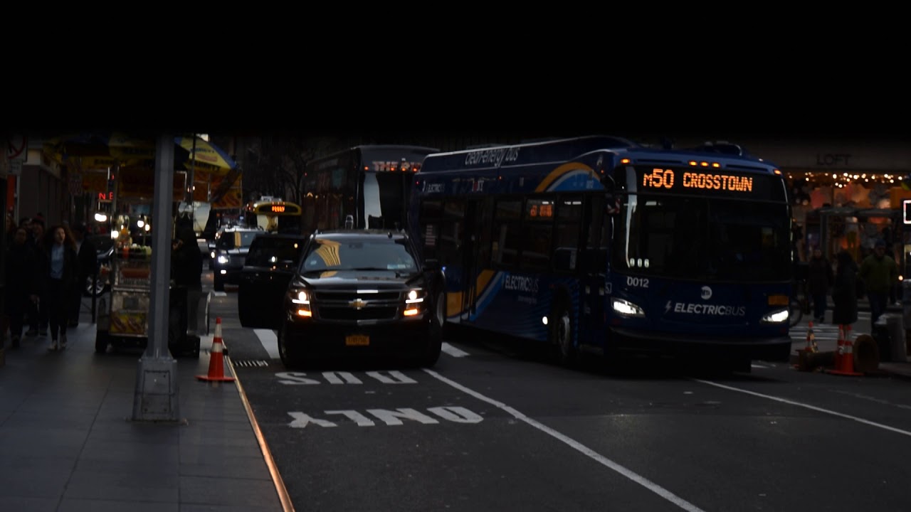 42nd Street Pier-bound XE40 (12) M50 bus approaching 49th Street/6th ...