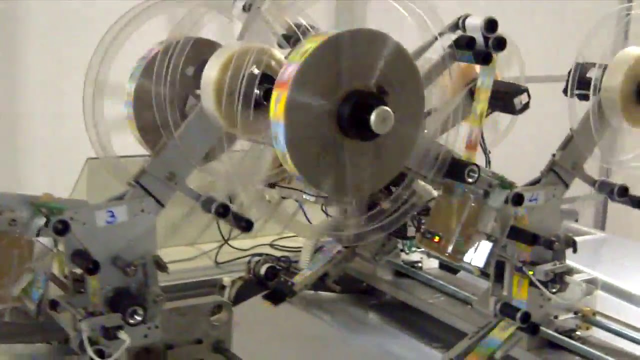 Multi track, offline, inpack very high speed labeling Applicant I - YouTube