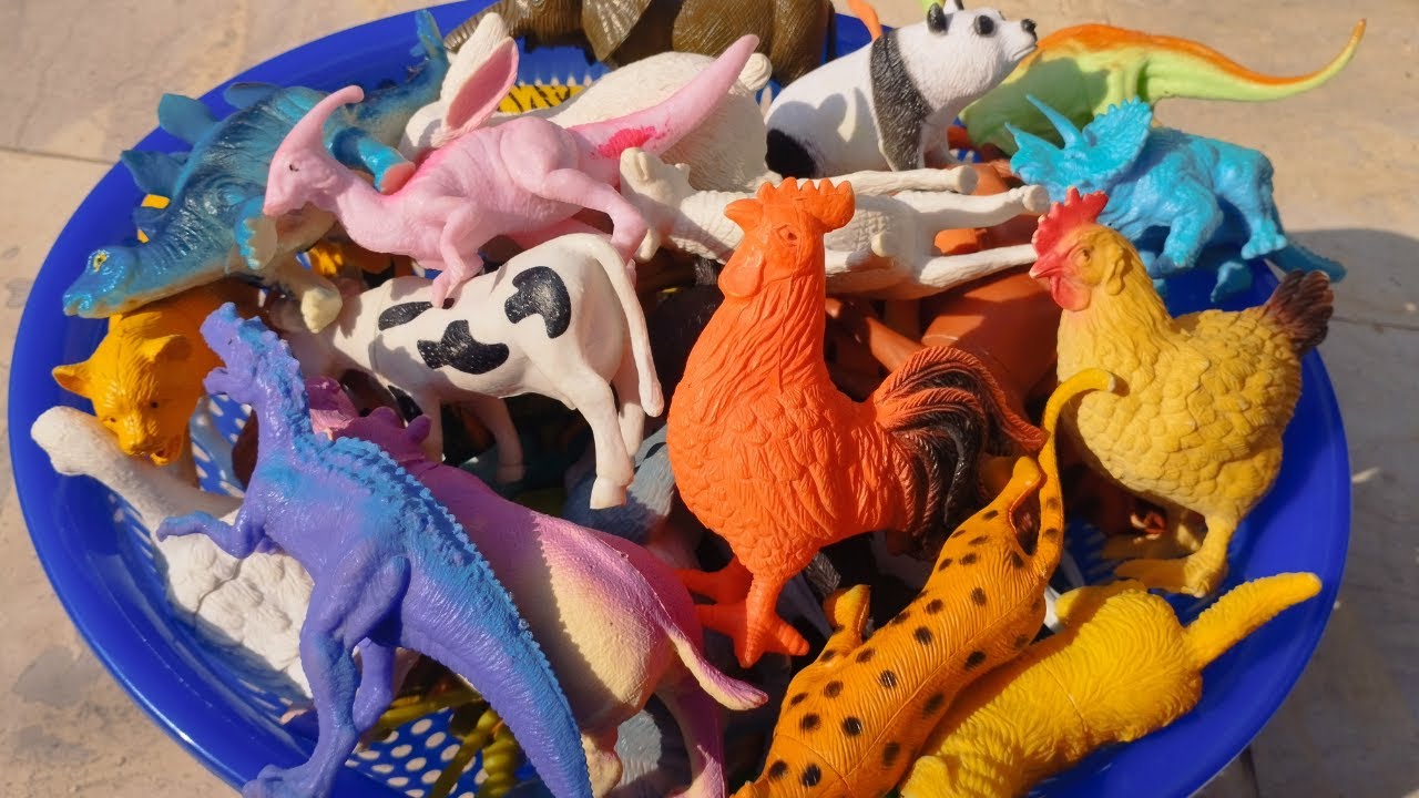 Box filled with various zoo animals toys , muddy animals , farm animals ...