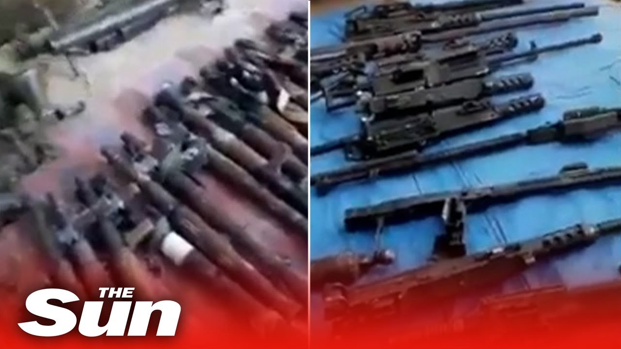 Taliban fighters display weapons claimed to be captured from Afghan ...