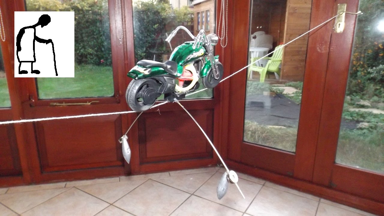 Toy Motorbike Balanced on a String - YouTube