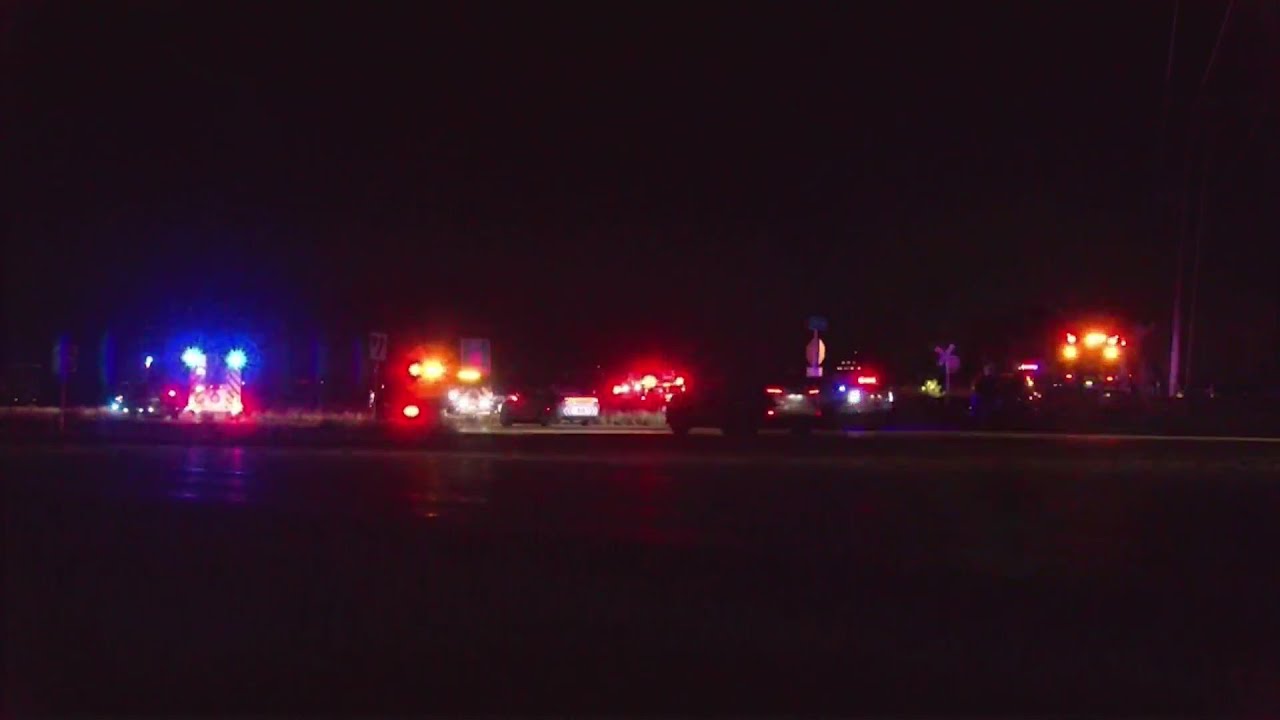 Train hits police car, hurting suspect in the backseat - YouTube