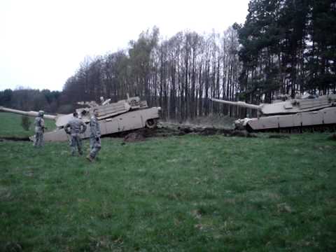 Pulling an M1A1 Abrams out of the mud at the JMTC - YouTube