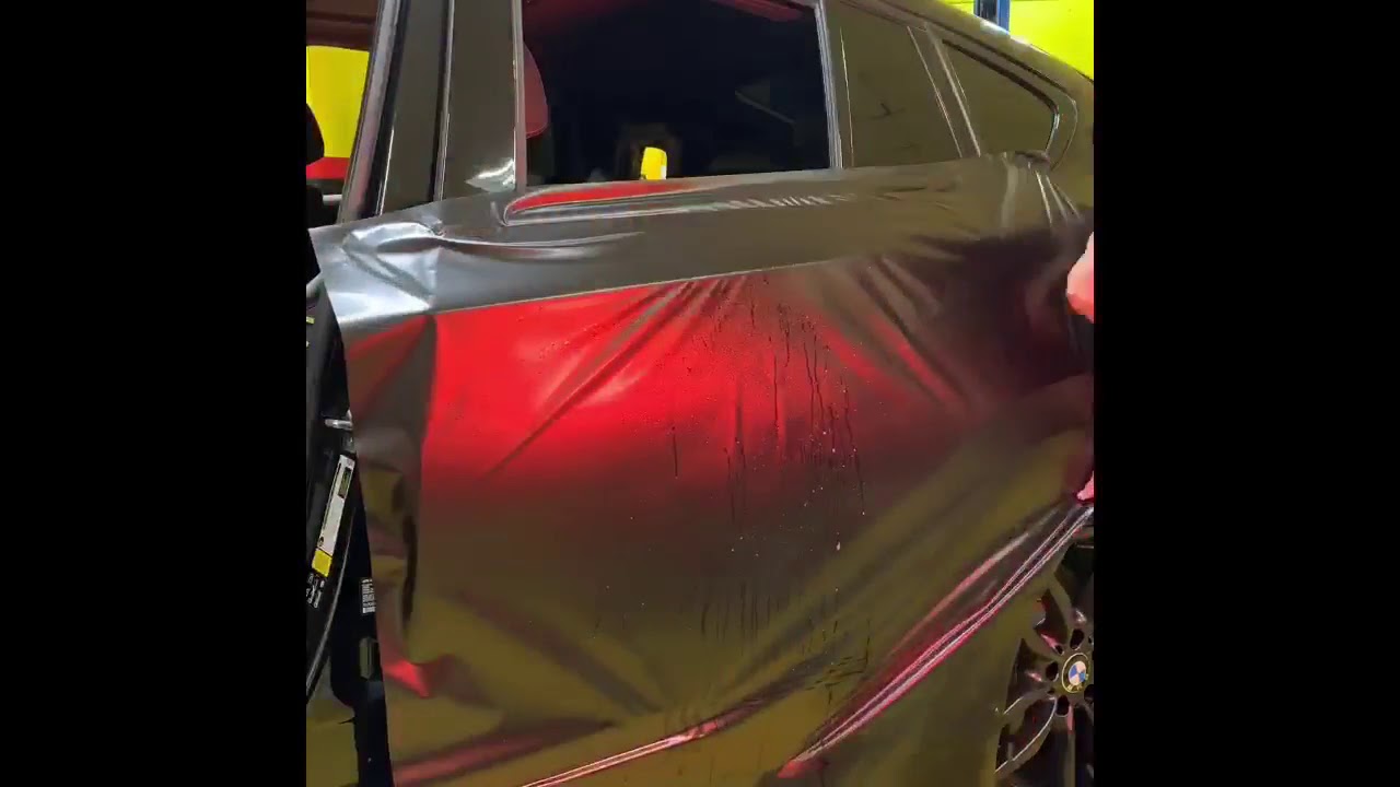 Wrapping a BMW X4 in Satin Black vinyl! - YouTube