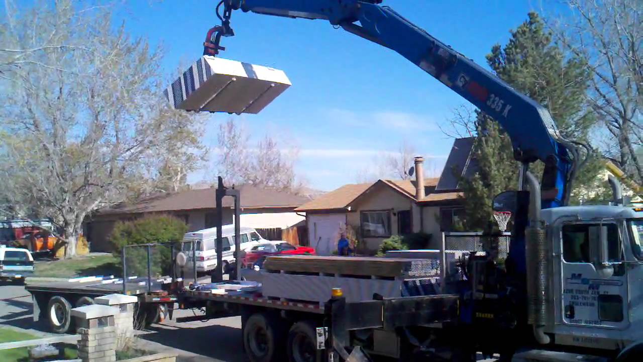 Crane loading drywall into our upstairs window - YouTube