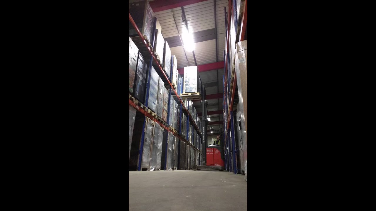How to put a pallet into the top racking - YouTube