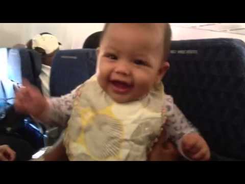Baby Ivy enjoying her first airplane flight - YouTube