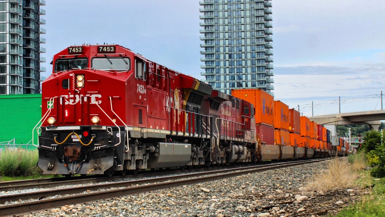 VERY RARE! CPKC 7453 ET44AC new paint unit leading CP stack train Eastbound arriving Calgary ...