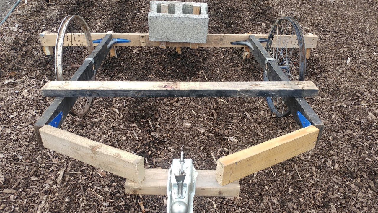 Homemade corn plow for planting in deep mulch garden - YouTube